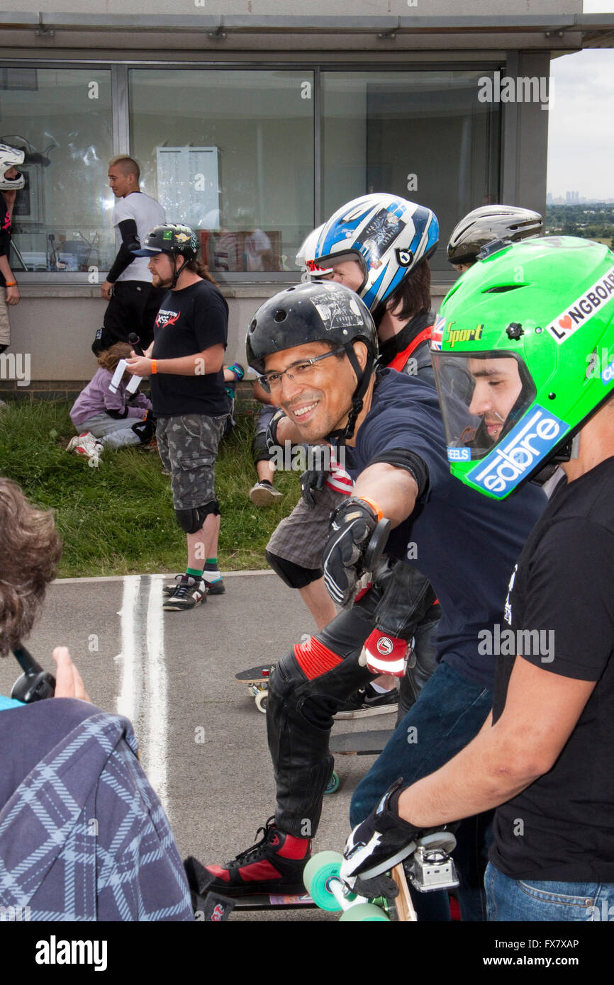 Downhill skateboarders on the line at the start of a race Stock Photo ...