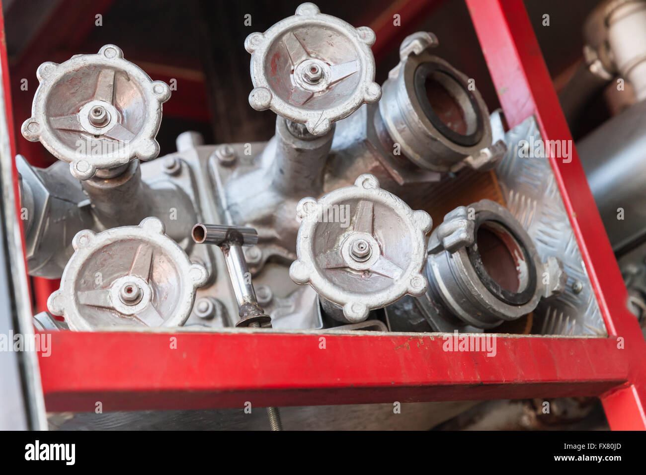 Firefighting equipment on red fire truck. Water hydrants closeup photo ...