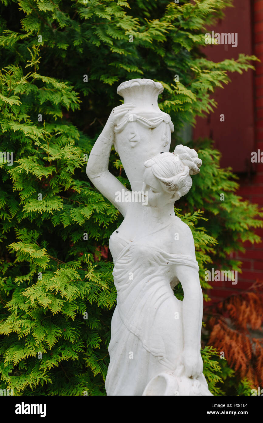 Beautiful female sculpture with a jug on her shoulder Stock Photo - Alamy