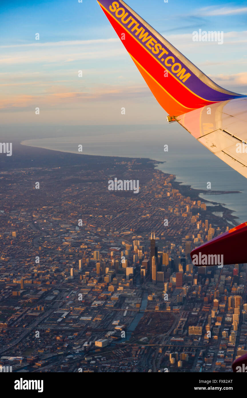 Aerial view showing clouds and aircraft wing over Chicago, Illinios ...