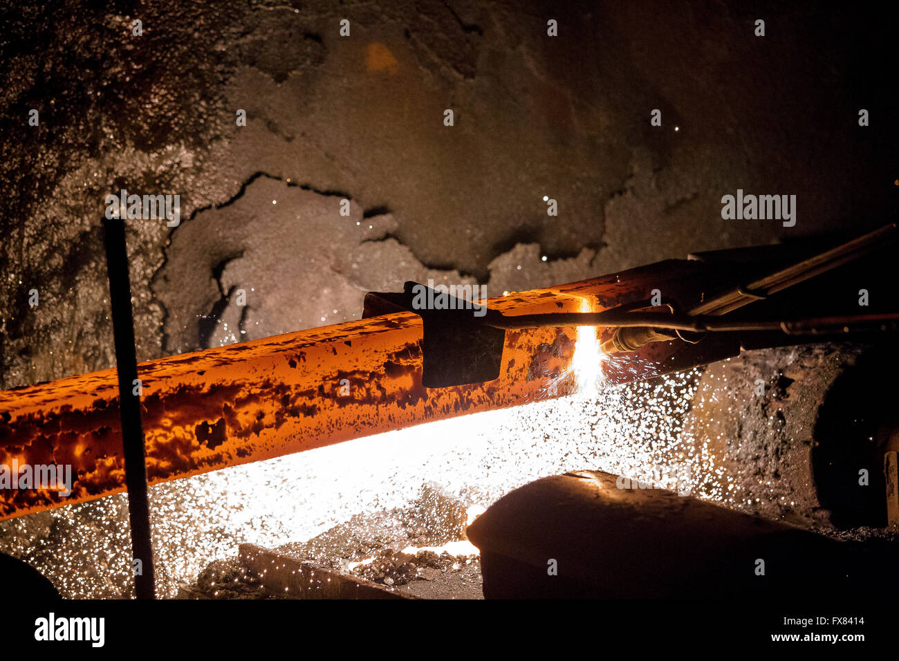 Heated metal pig gets squeezed and drilled at special metal forging ...