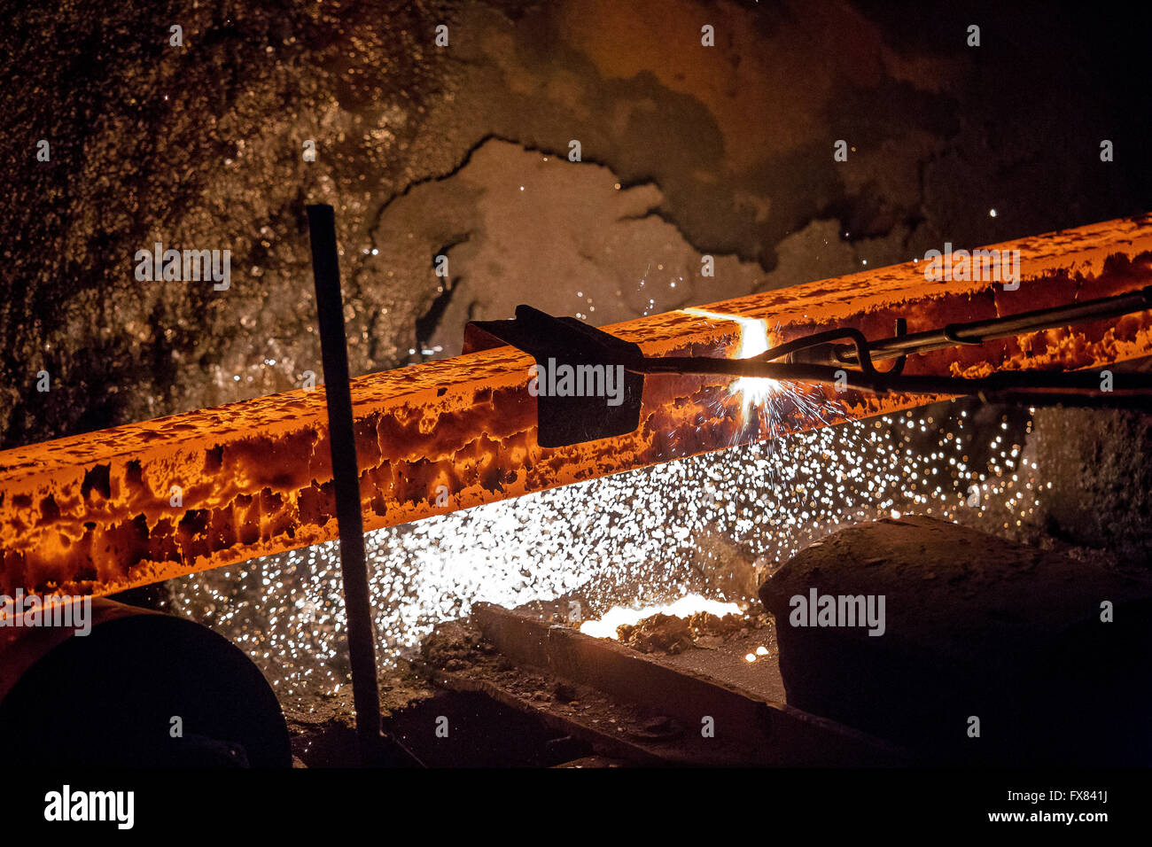 Heated metal pig gets squeezed and drilled at special metal forging ...