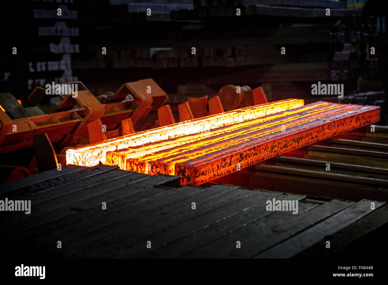 Heated metal pig gets squeezed and drilled at special metal forging ...