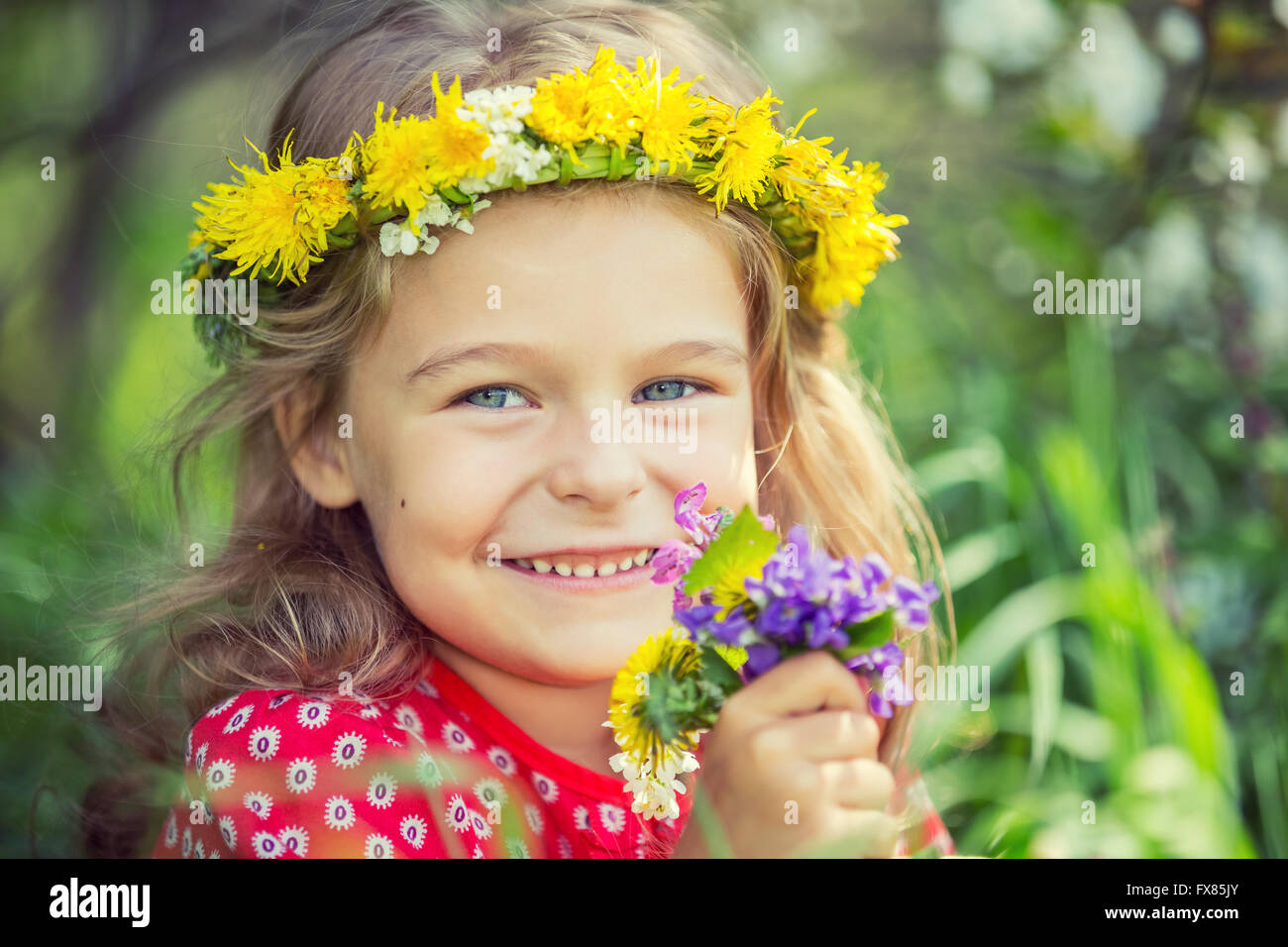 Little girl in spring park Stock Photo - Alamy