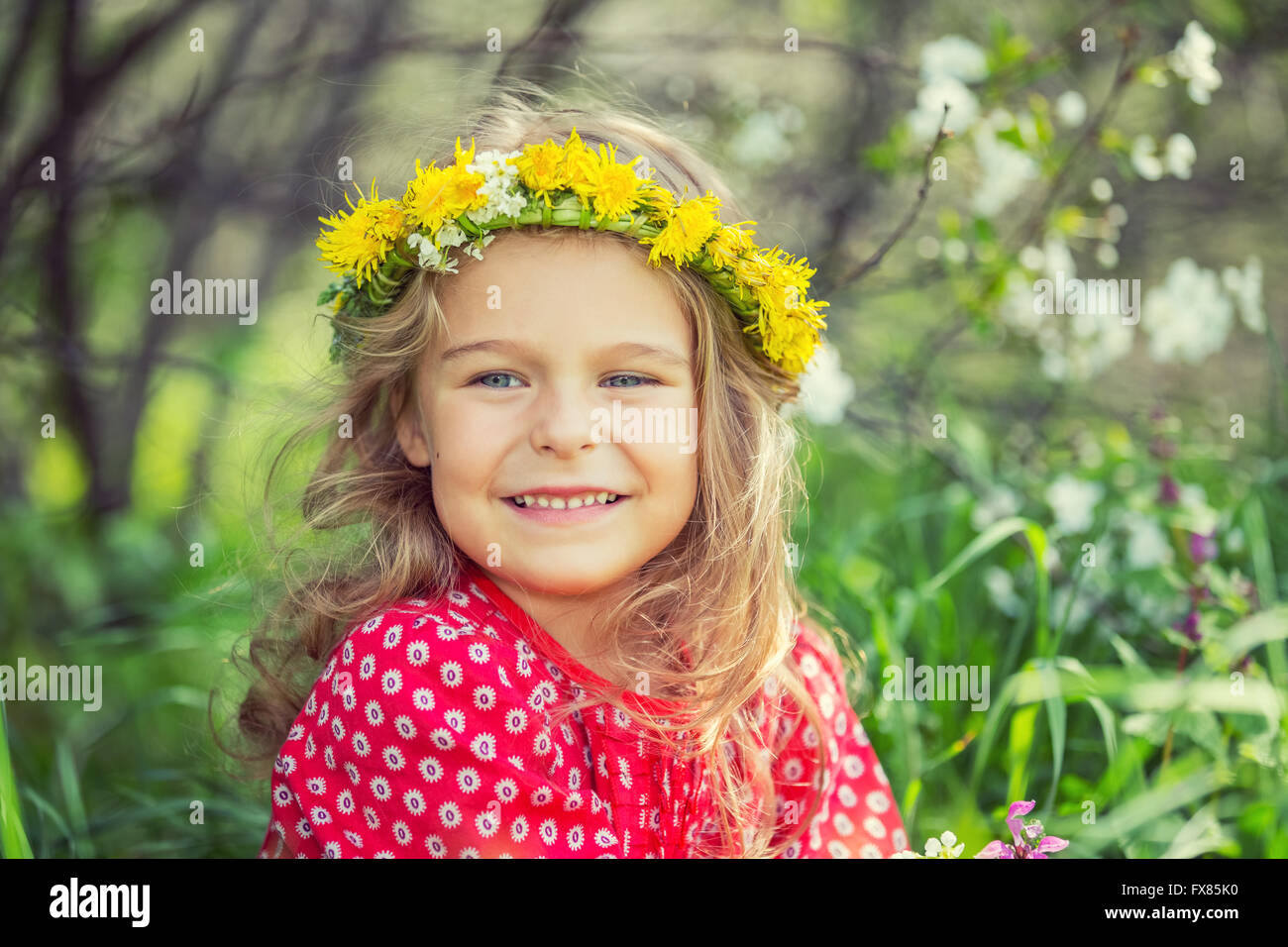 Little girl in spring park Stock Photo - Alamy