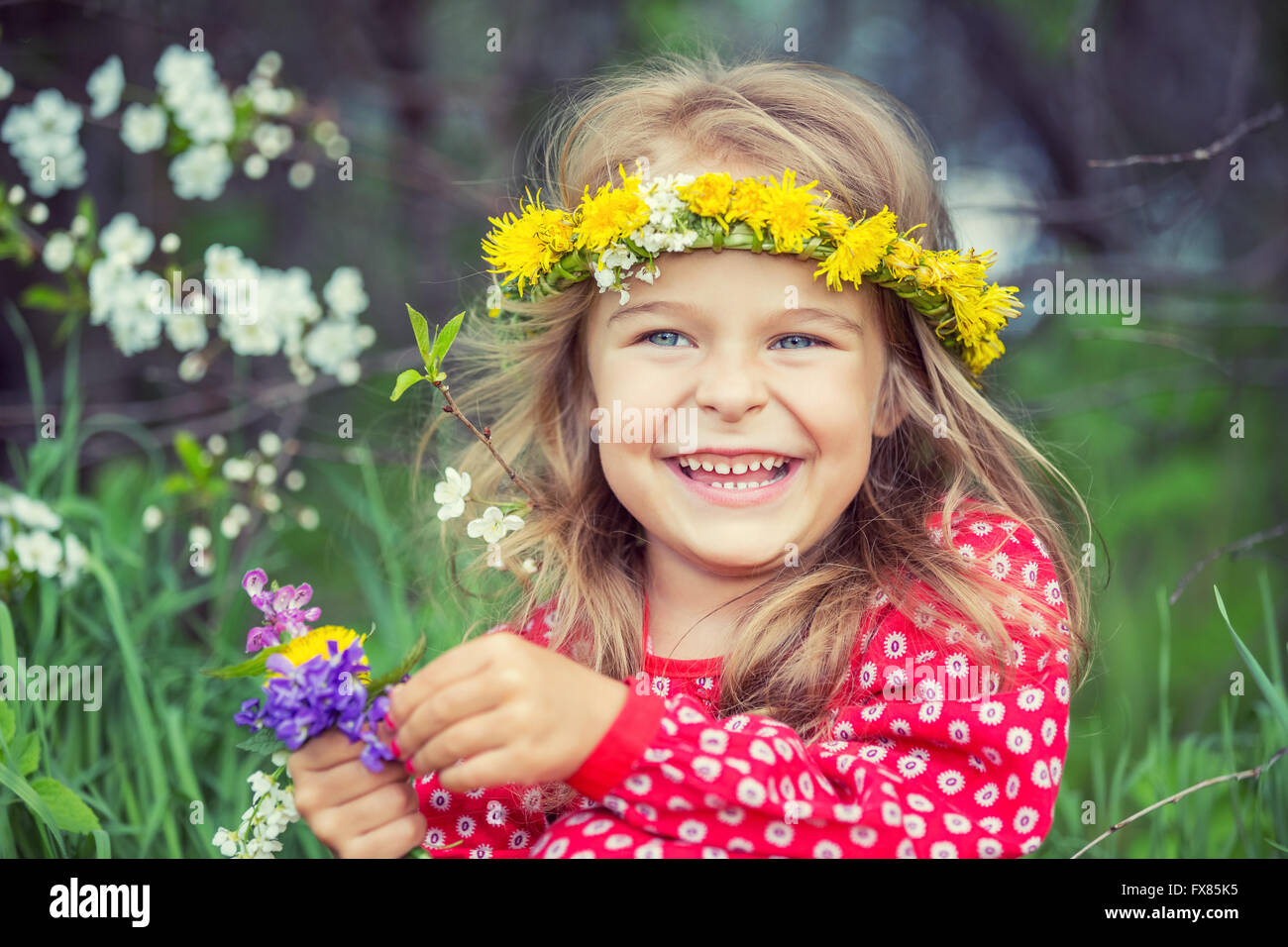 Little girl in spring park Stock Photo - Alamy