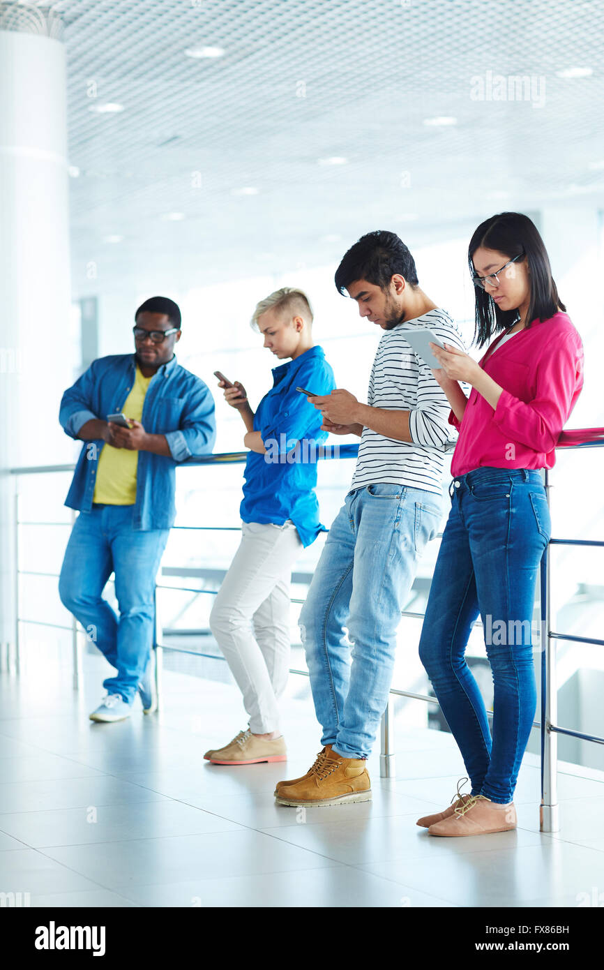 Students with gadgets Stock Photo - Alamy