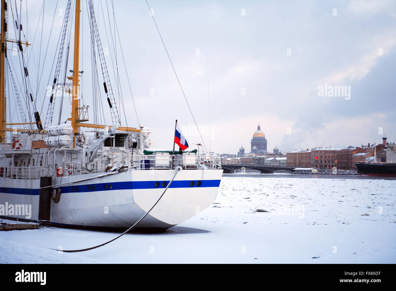 Ship on frozen river Neva against Isaac Cathedral in St. Petersburg ...