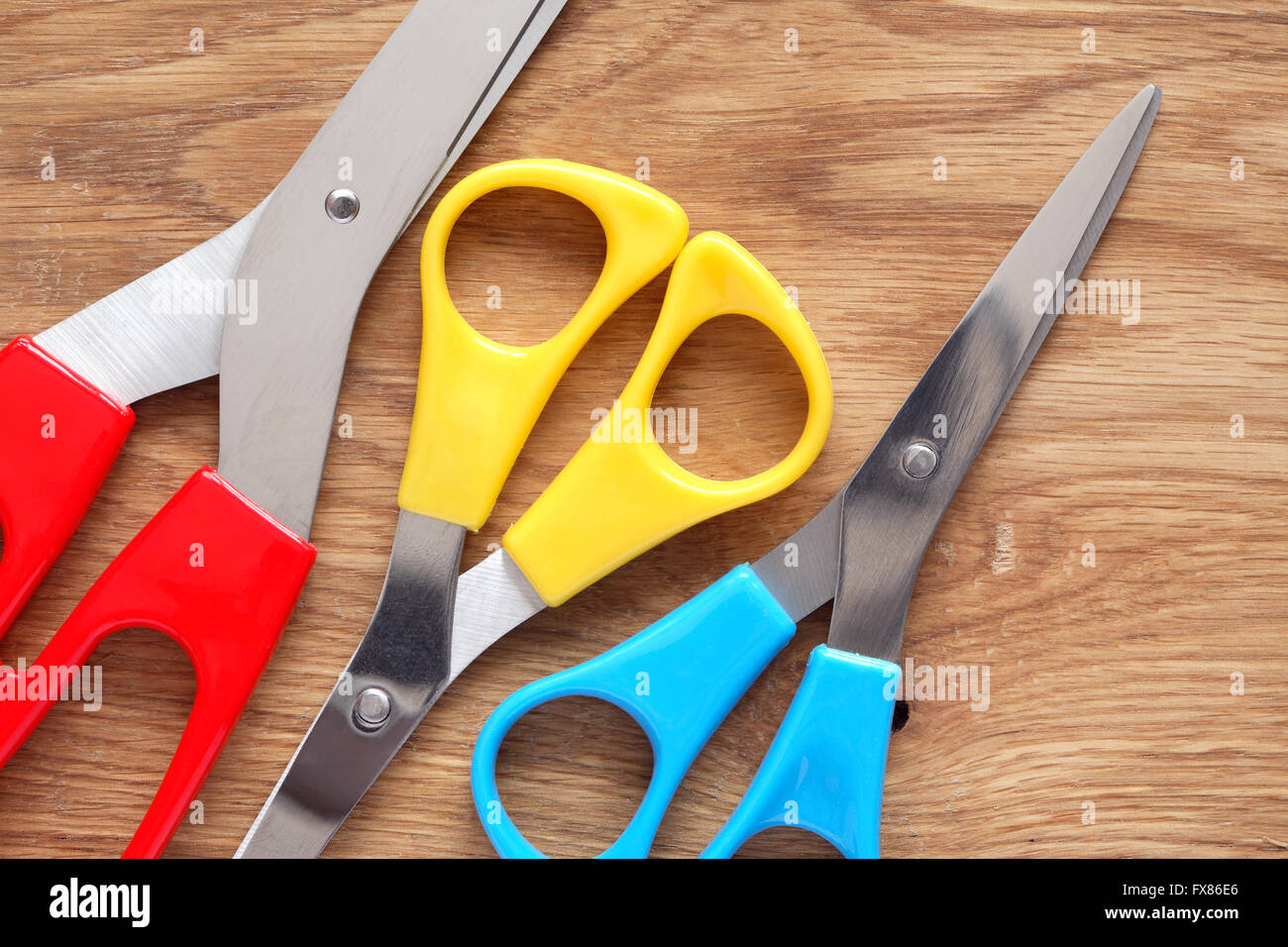 Set of various scissors on wooden background Stock Photo - Alamy