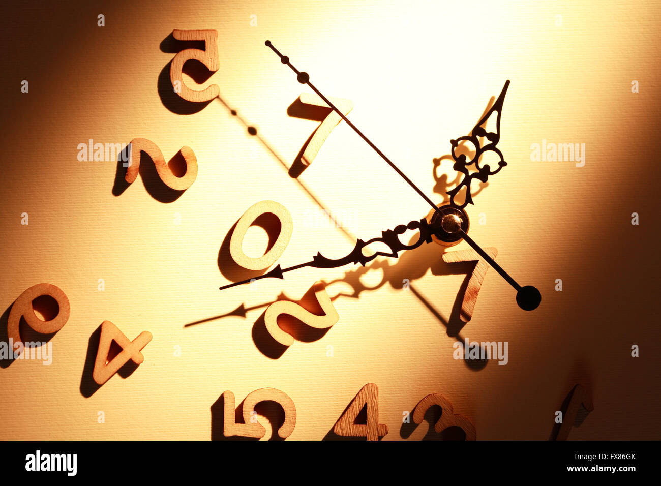Time concept. Clock face near set of wooden digits Stock Photo - Alamy