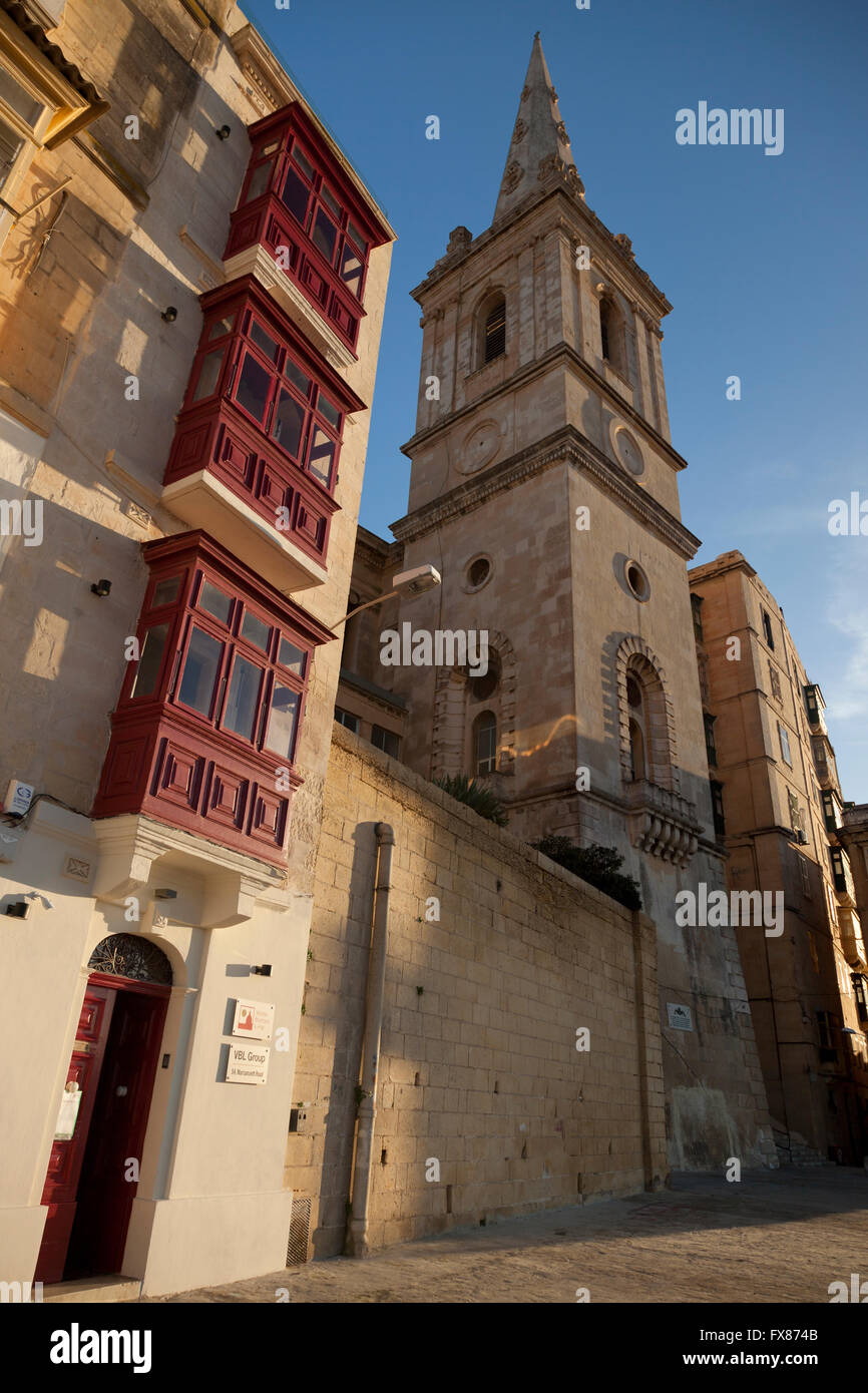 The spire of the Anglican Cathedral and typical multi-storey townhouse ...