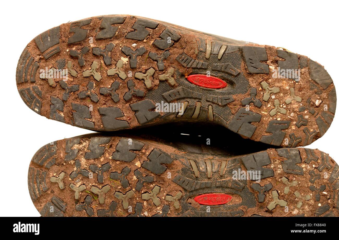 Dried mud on the underside of a pair of walking boots Stock Photo - Alamy