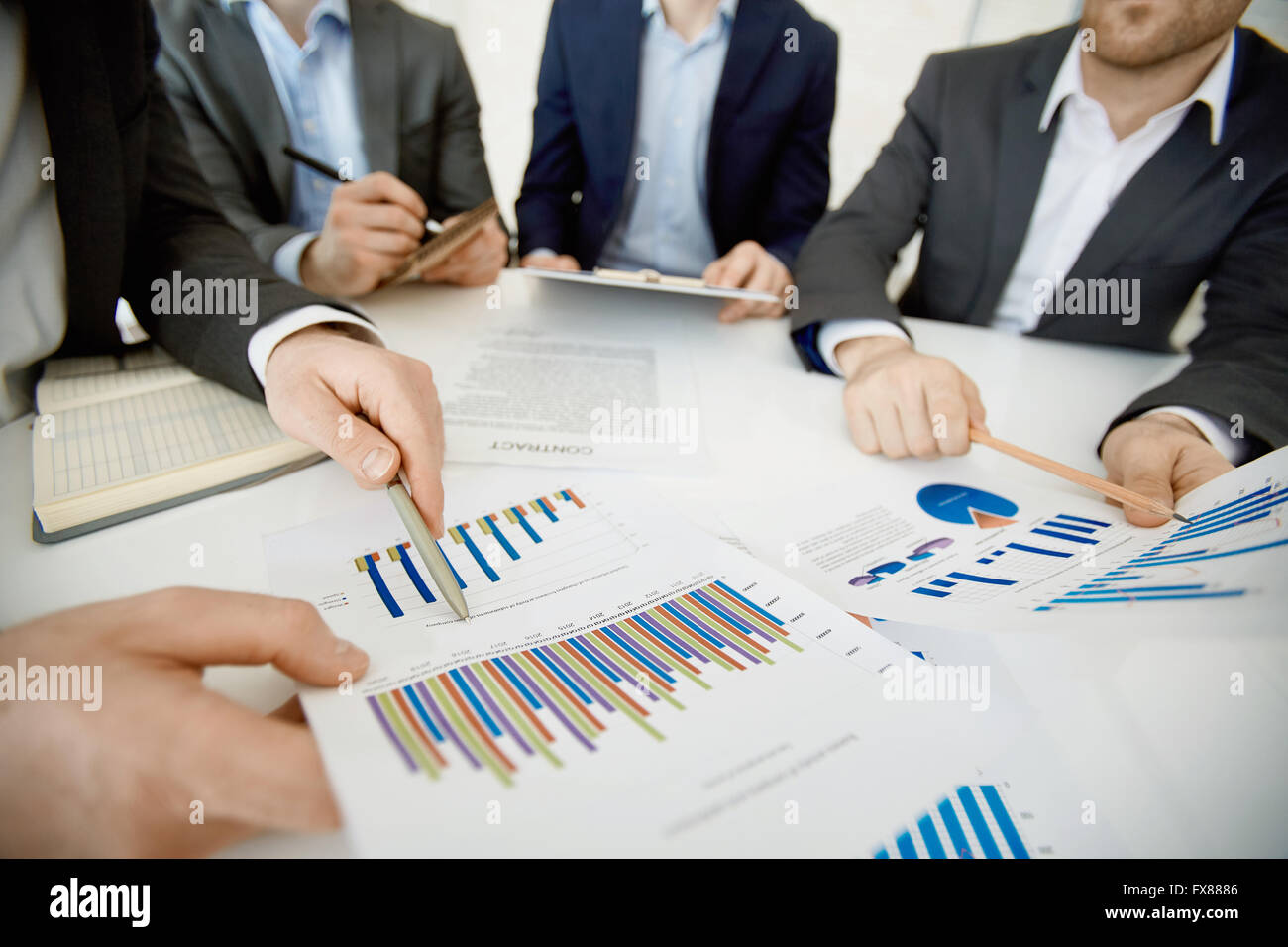 Young man showing financial report hi-res stock photography and images ...