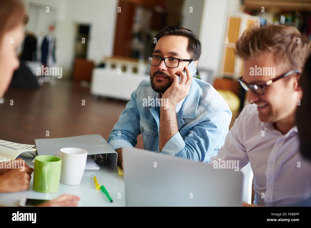 Calling at meeting Stock Photo - Alamy