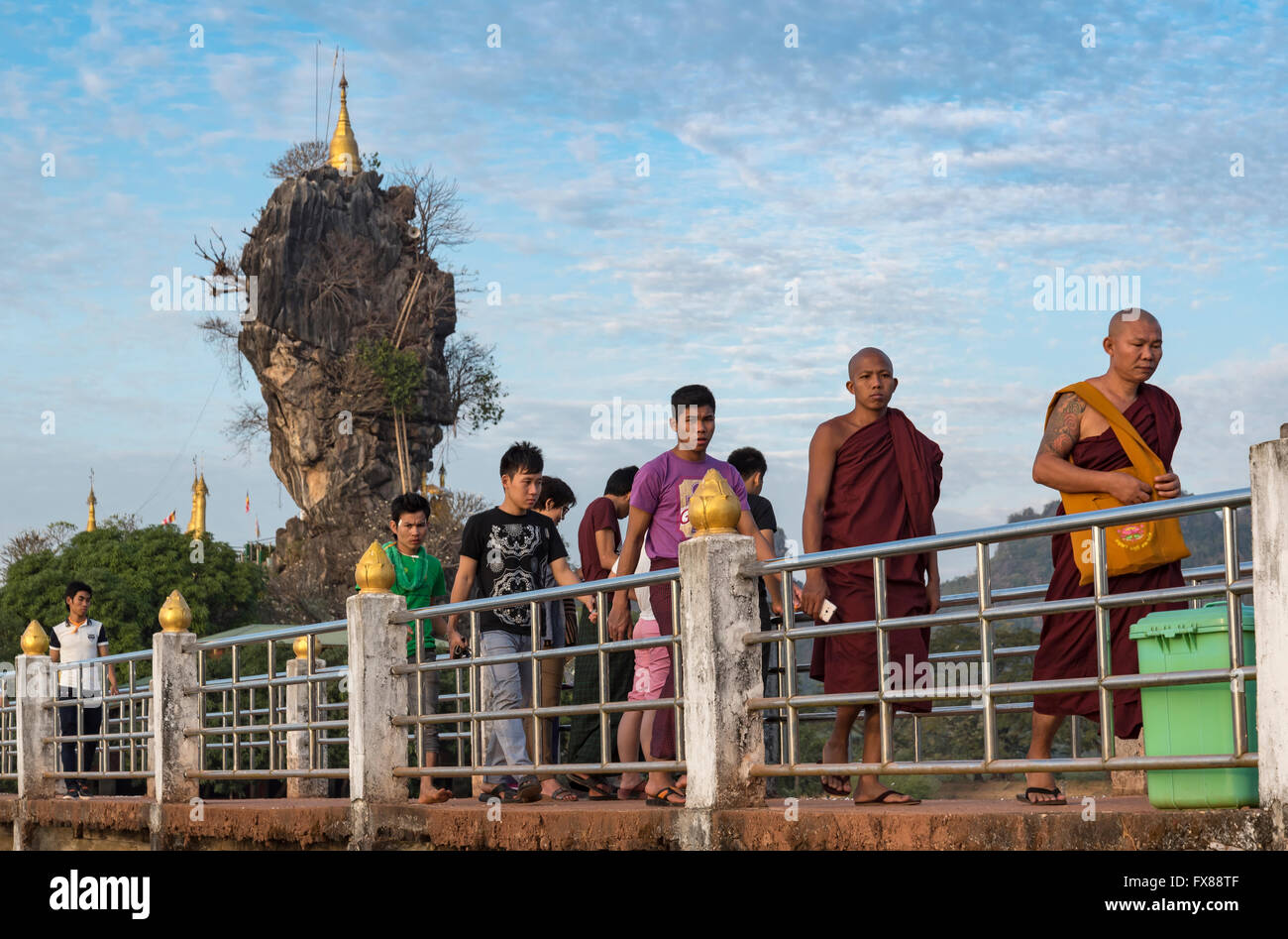 People cross the bridge to Kyauk Kalap (Kyauk Ka Lat) Pagoda near Hpa ...