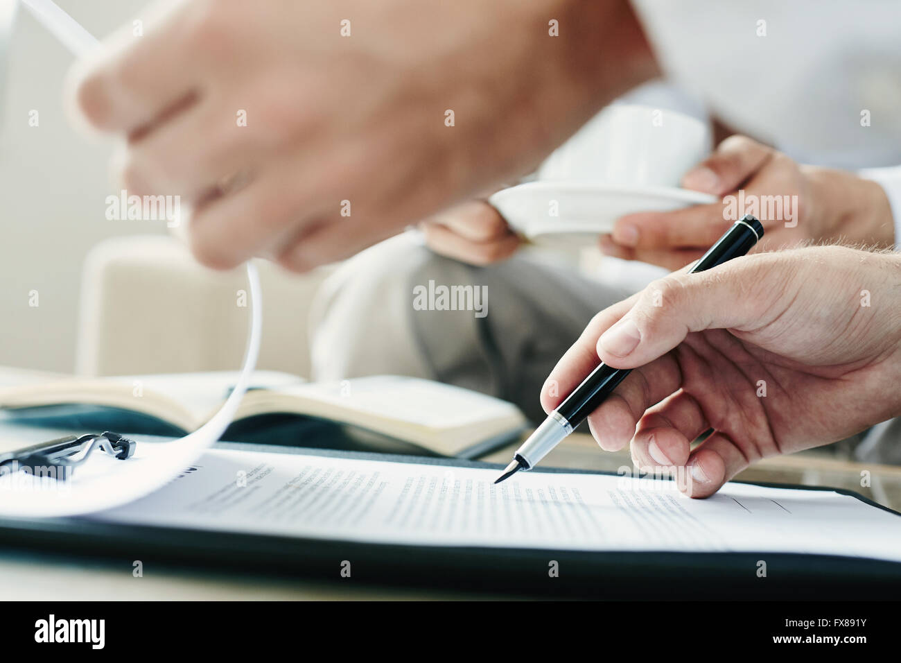 Reading terms of contract Stock Photo - Alamy