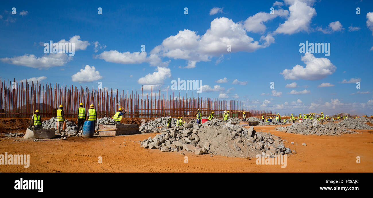 Workmen in high viz jackets working on Voi station on the Chinese ...