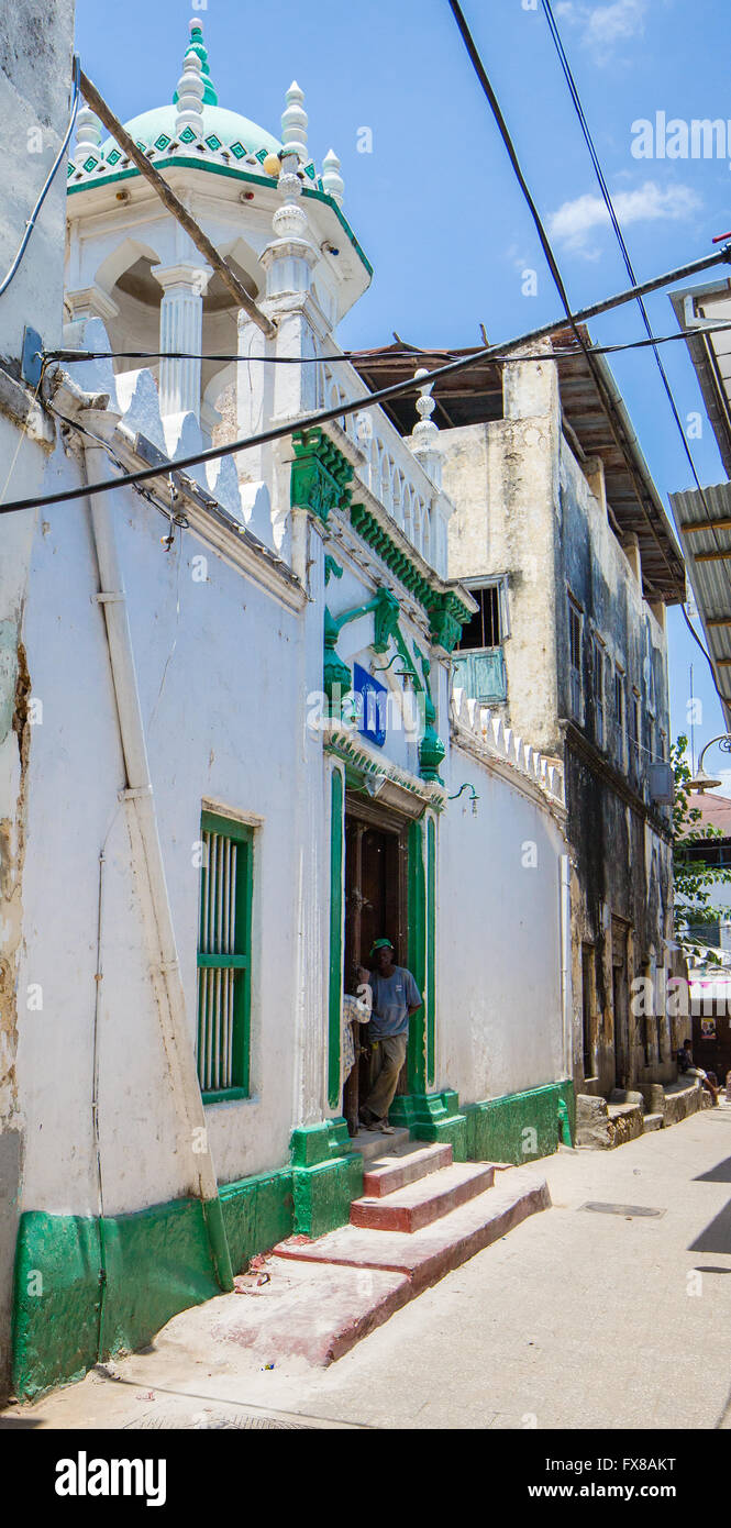 Green and white painted Mosque in a street of Stone Town in Zanzibar ...