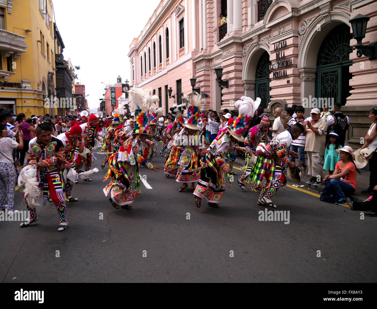 People in traditional Peruvian dress dancing in the street in Lima ...