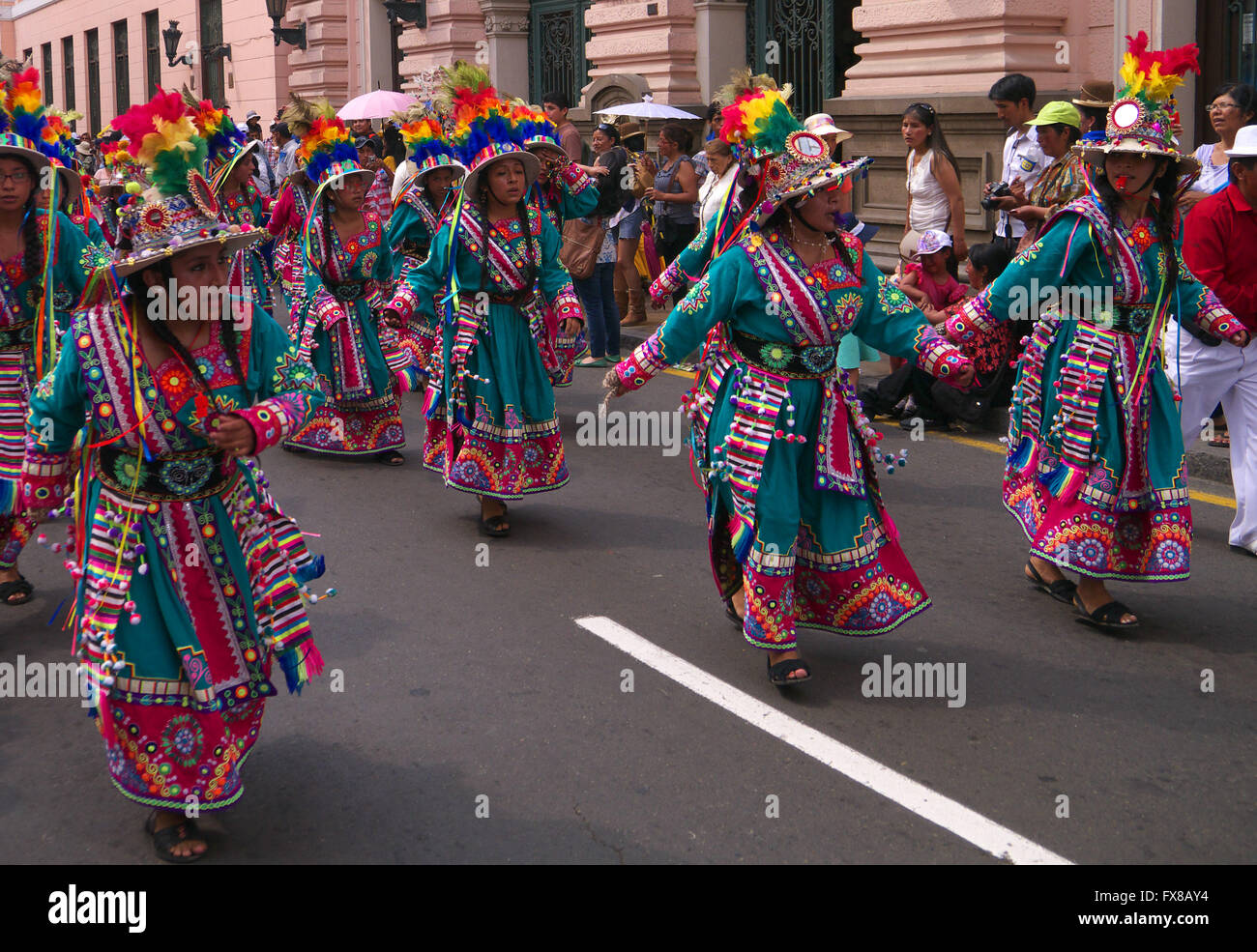 Women In Traditional Peruvian Dress Dancing In The Street In Lima Stock