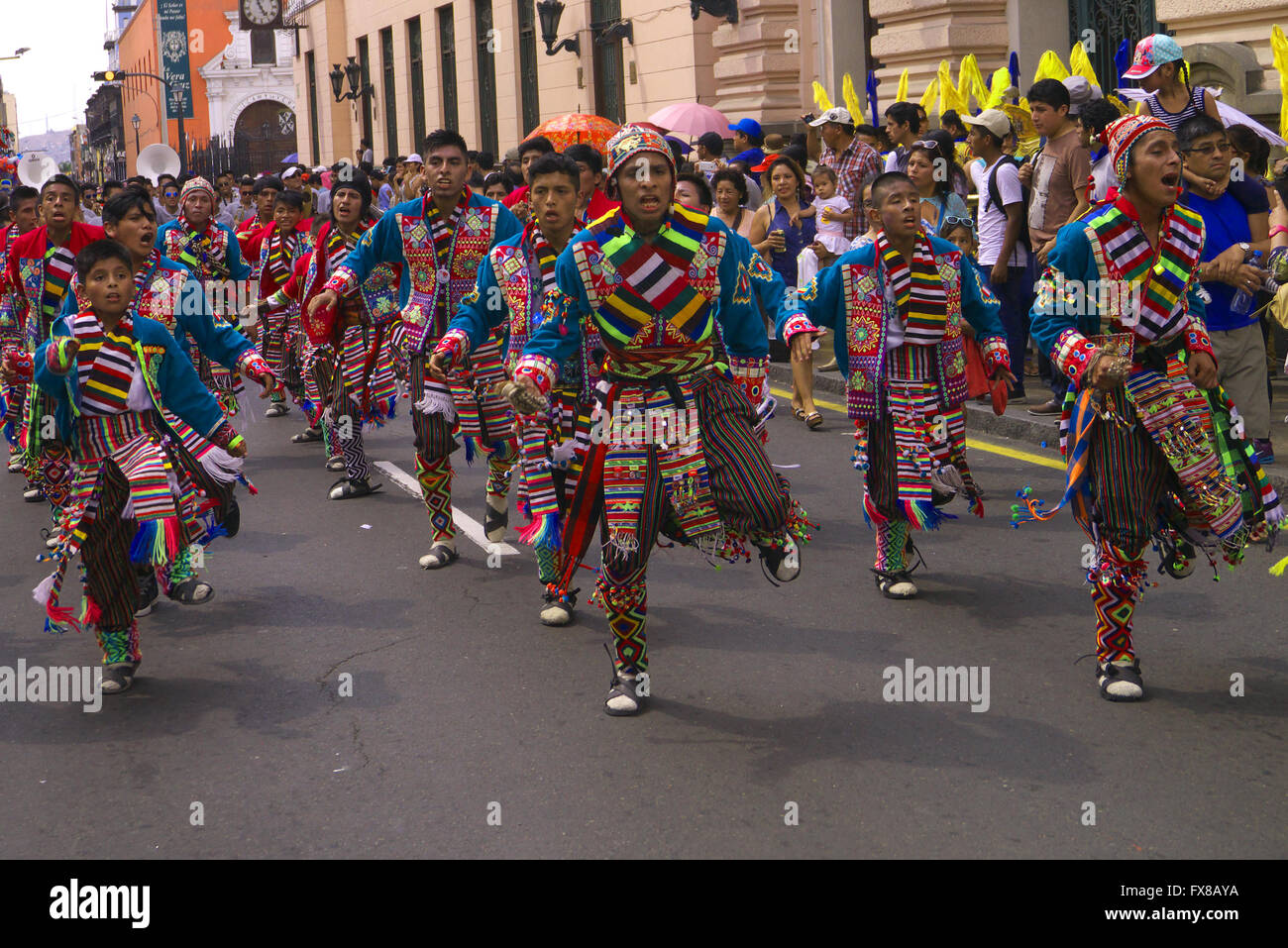 People in traditional Peruvian dress dancing in the street in Lima ...