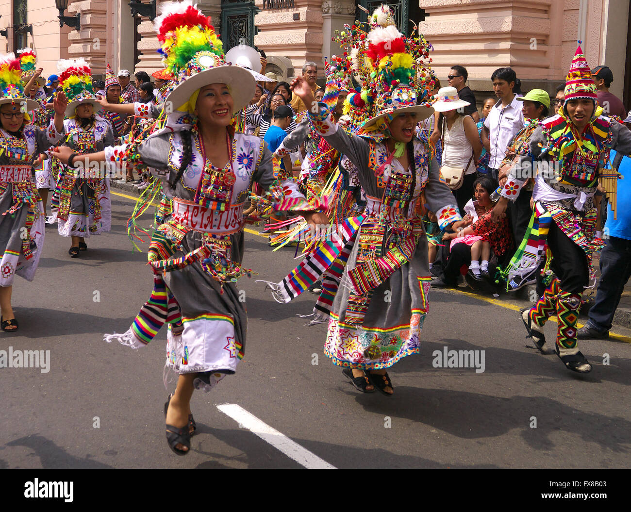 People In Traditional Peruvian Dress Dancing In The Street In Lima