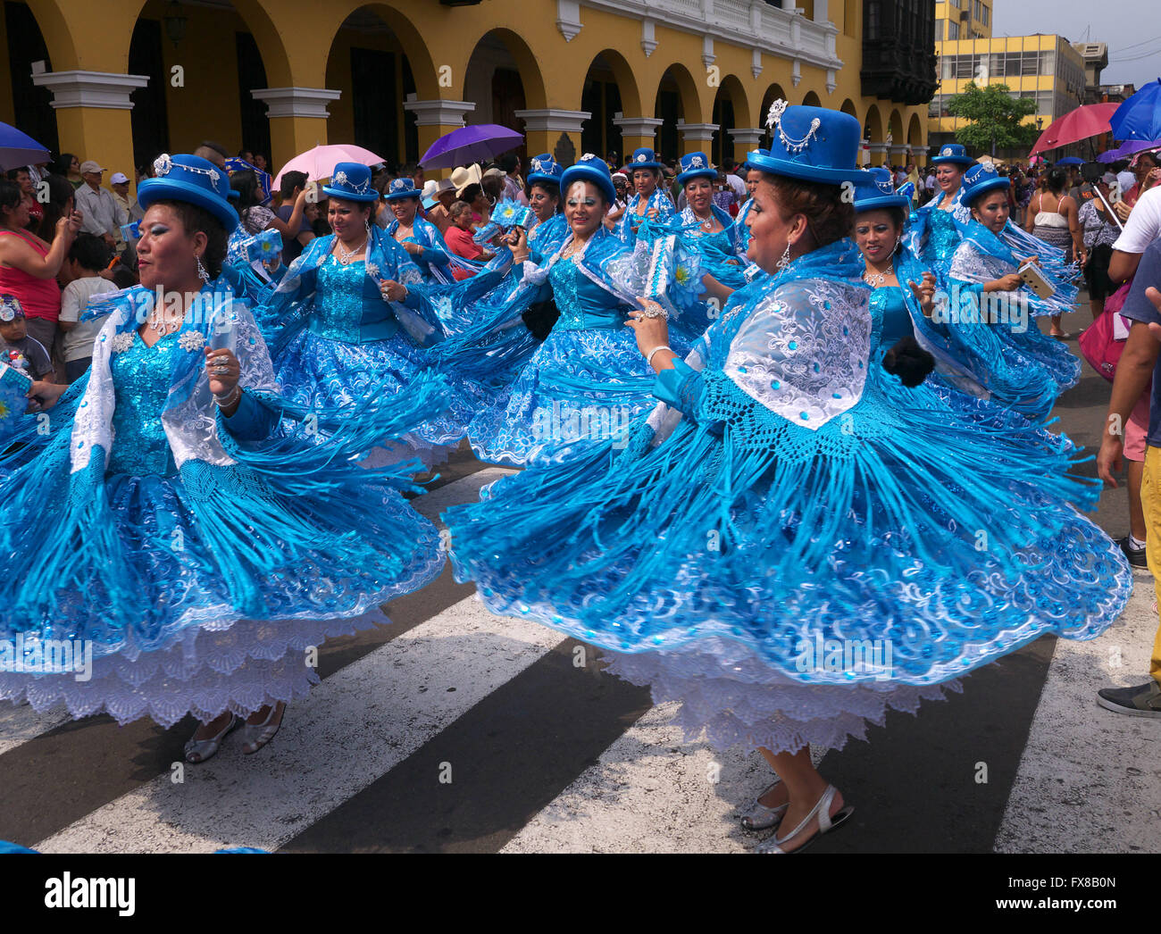 People in traditional Peruvian dress dancing in the street in Lima ...