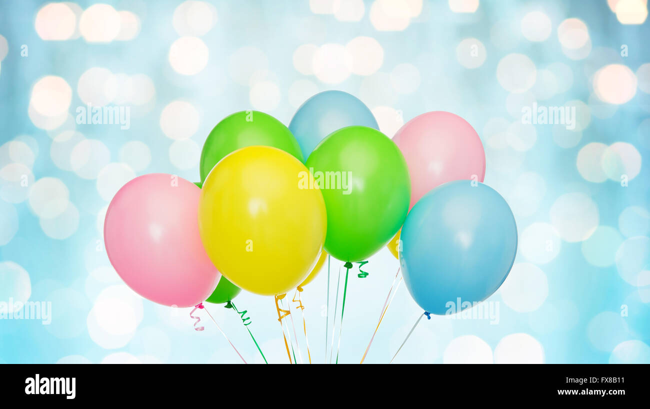 bunch of inflated helium balloons over blue lights Stock Photo - Alamy