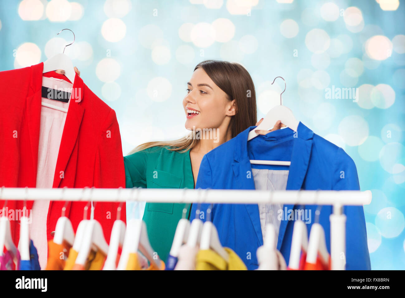 happy woman choosing clothes at wardrobe Stock Photo - Alamy