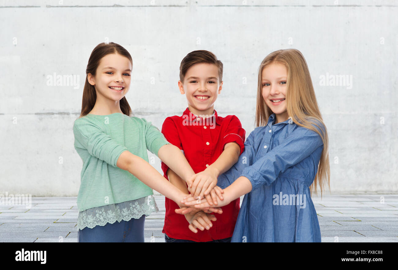 happy children with hands on top Stock Photo - Alamy