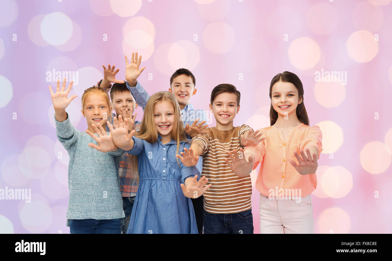 happy children waving hands Stock Photo - Alamy