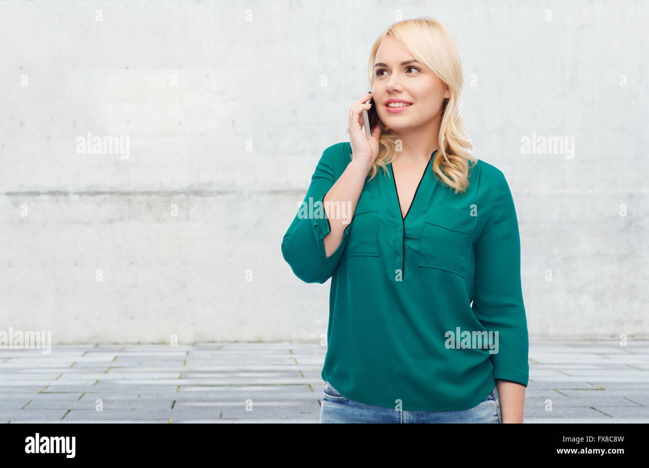 happy young woman calling on smartphone Stock Photo - Alamy