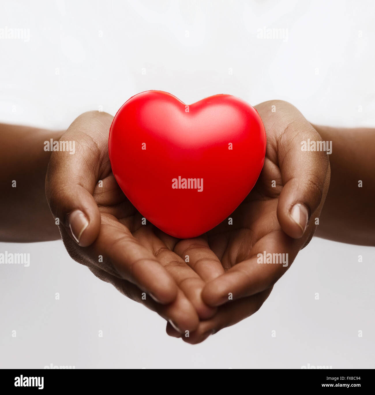 Heart hands african volunteer hi-res stock photography and images - Alamy