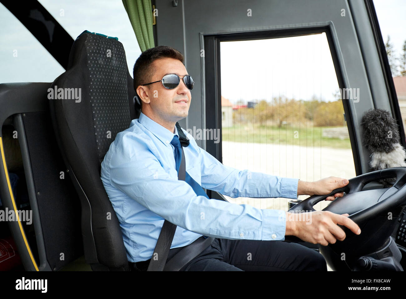happy driver driving intercity bus Stock Photo - Alamy