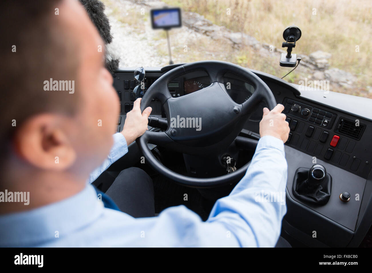 close up of driver driving passenger bus Stock Photo - Alamy