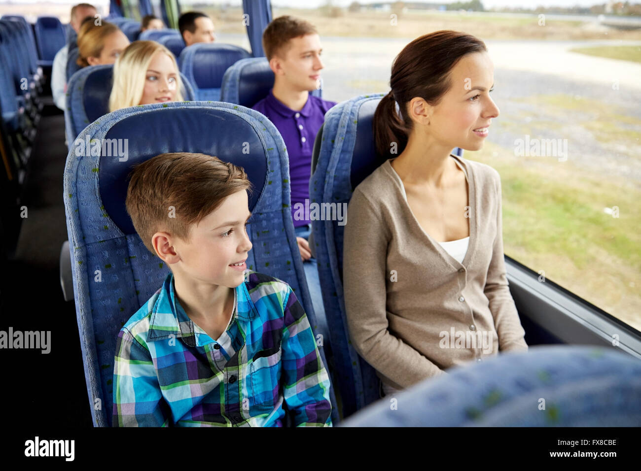 happy family riding in travel bus Stock Photo - Alamy