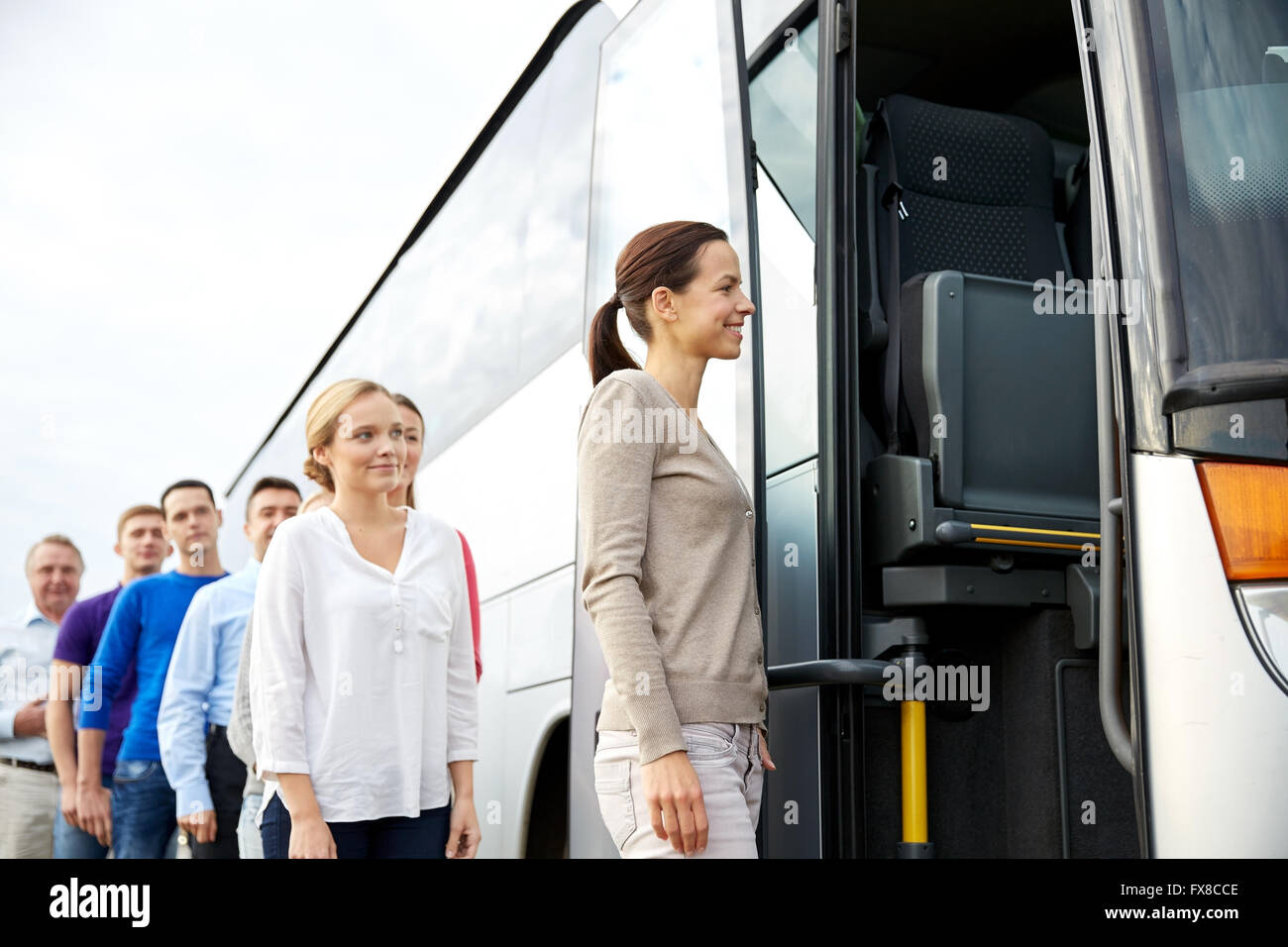 group of happy passengers boarding travel bus Stock Photo - Alamy
