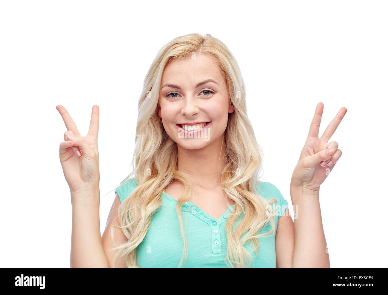 smiling young woman or teenage girl showing peace Stock Photo - Alamy