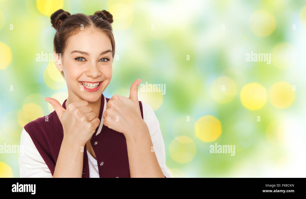 happy teenage girl showing thumbs up Stock Photo - Alamy