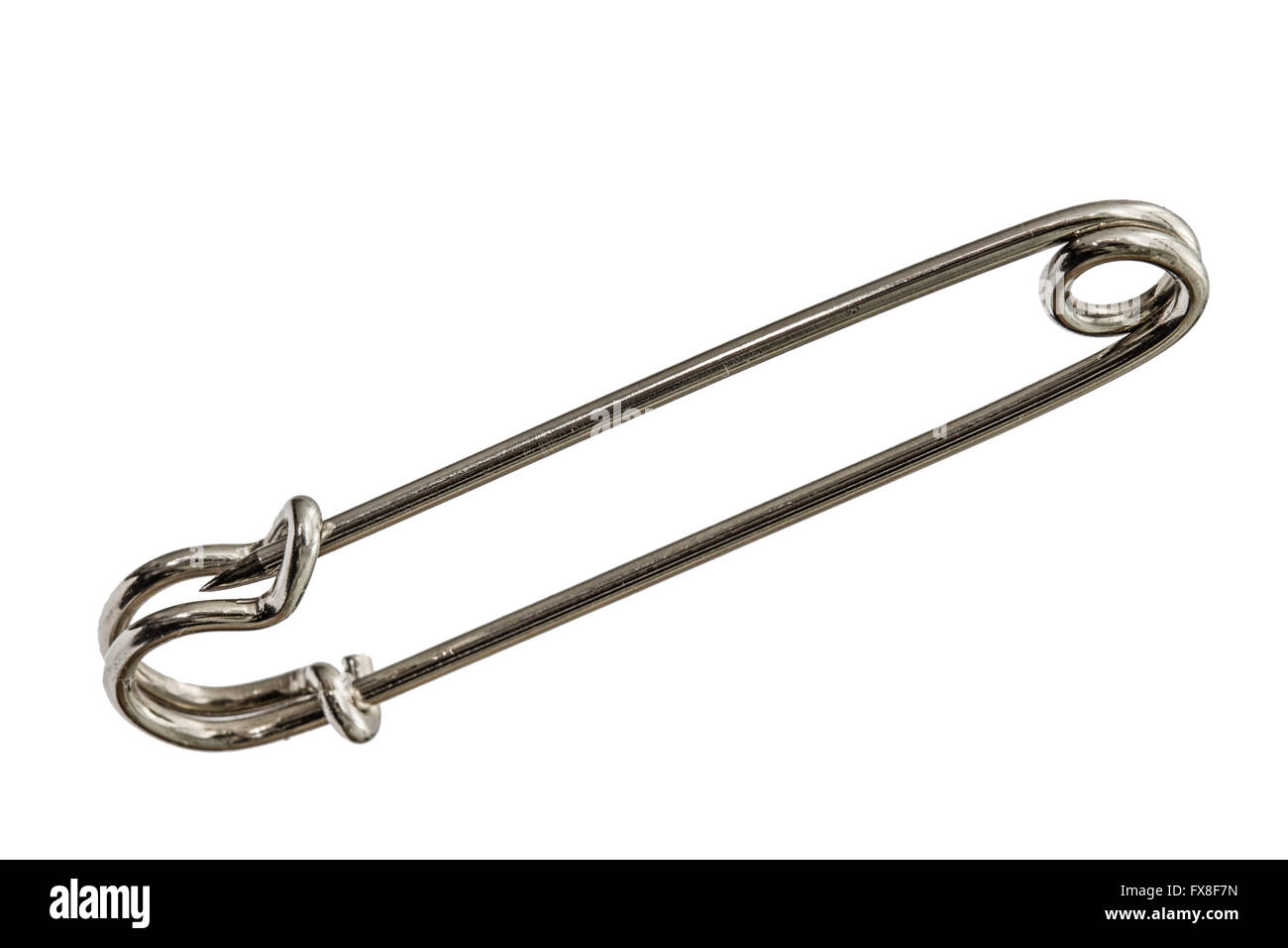 Safety pin, isolated on white background Stock Photo - Alamy