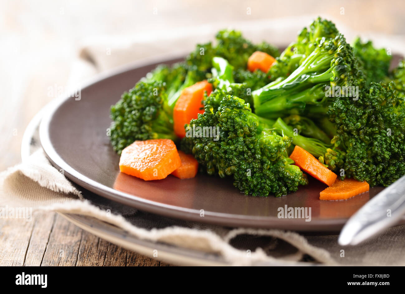 Steamed broccoli on plate Stock Photo - Alamy
