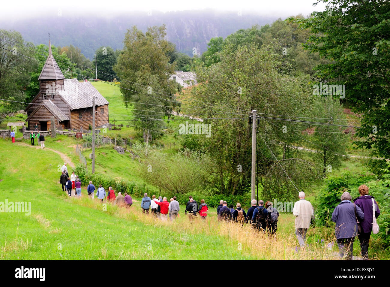 Tourists visiting Holdhus timber church in Norway Stock Photo - Alamy