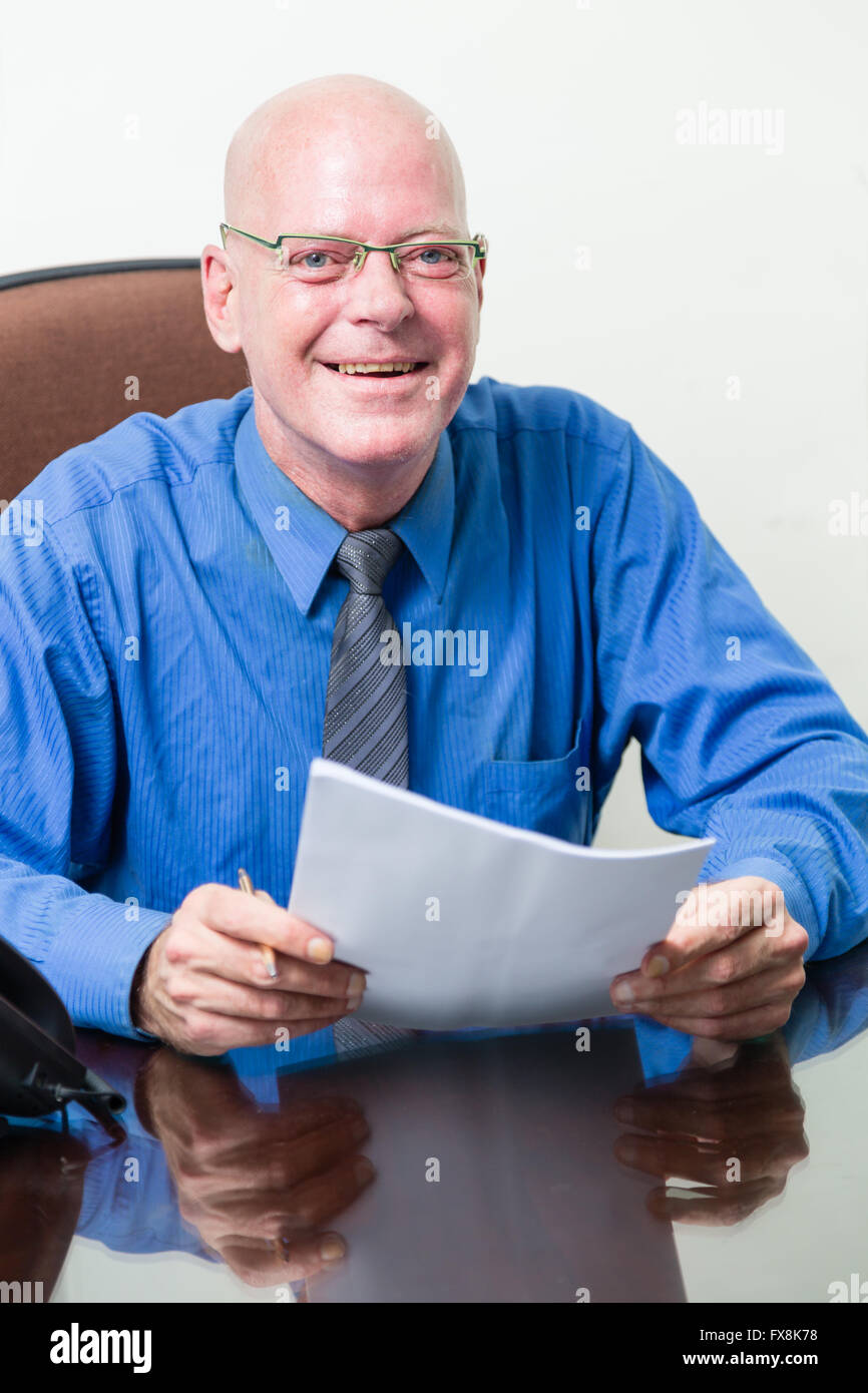 Man 50 desk looking at camera hi-res stock photography and images - Alamy