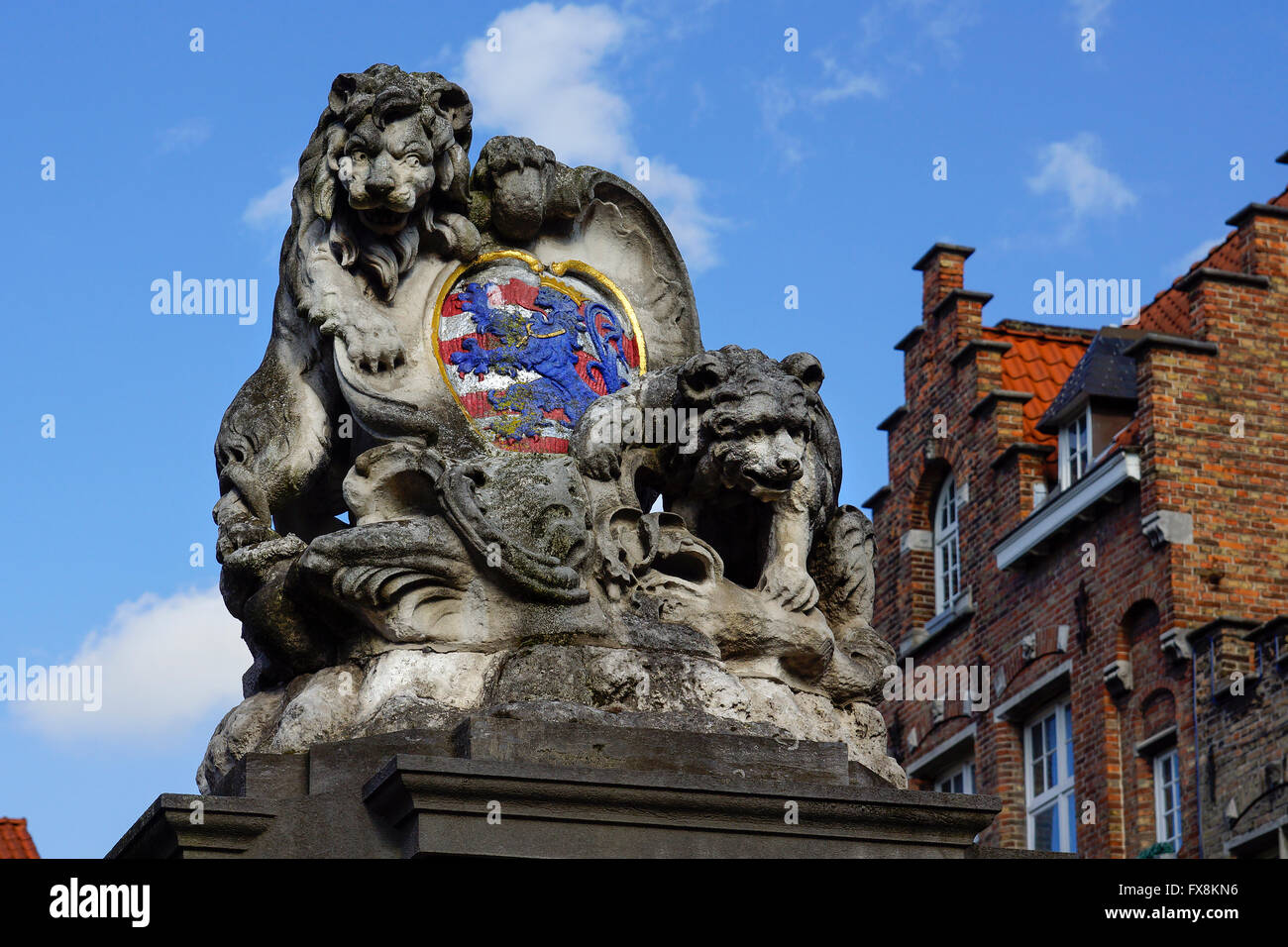 Stone statue of bear and lion in Bruges, Belgium Stock Photo - Alamy