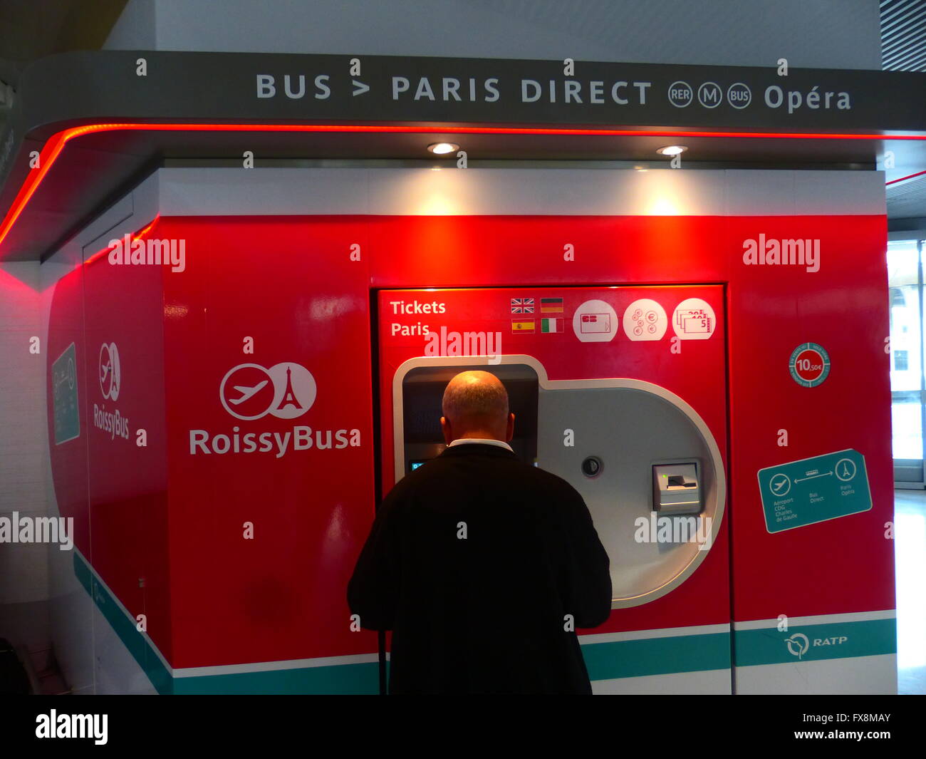Man uses ATM to take out cash Stock Photo - Alamy