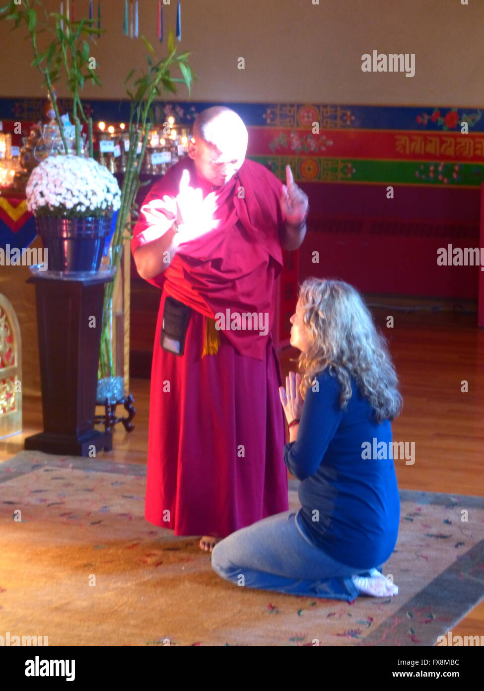 Buddhist monk with his praying pupil Stock Photo - Alamy