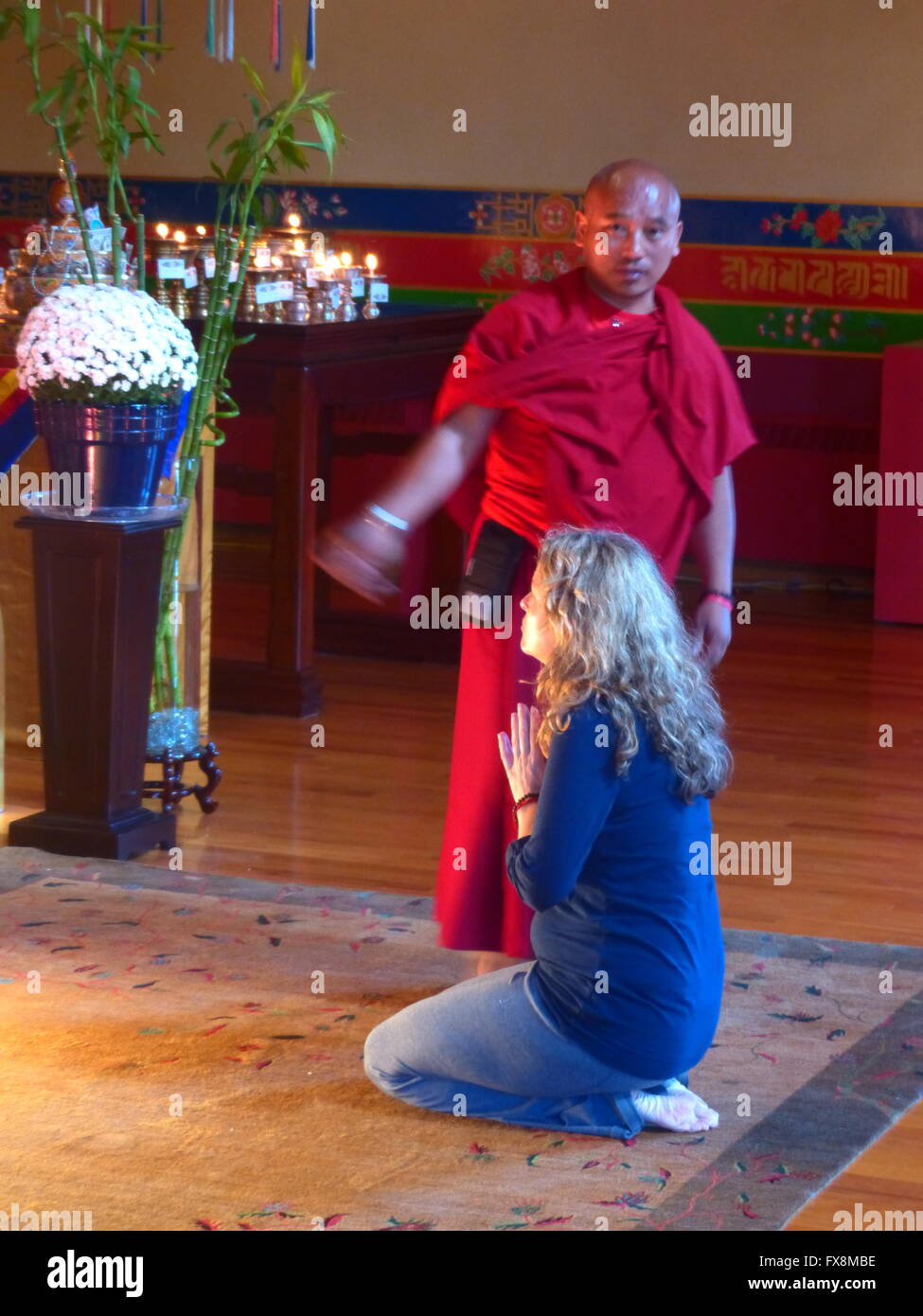Buddhist monk with his praying pupil Stock Photo - Alamy