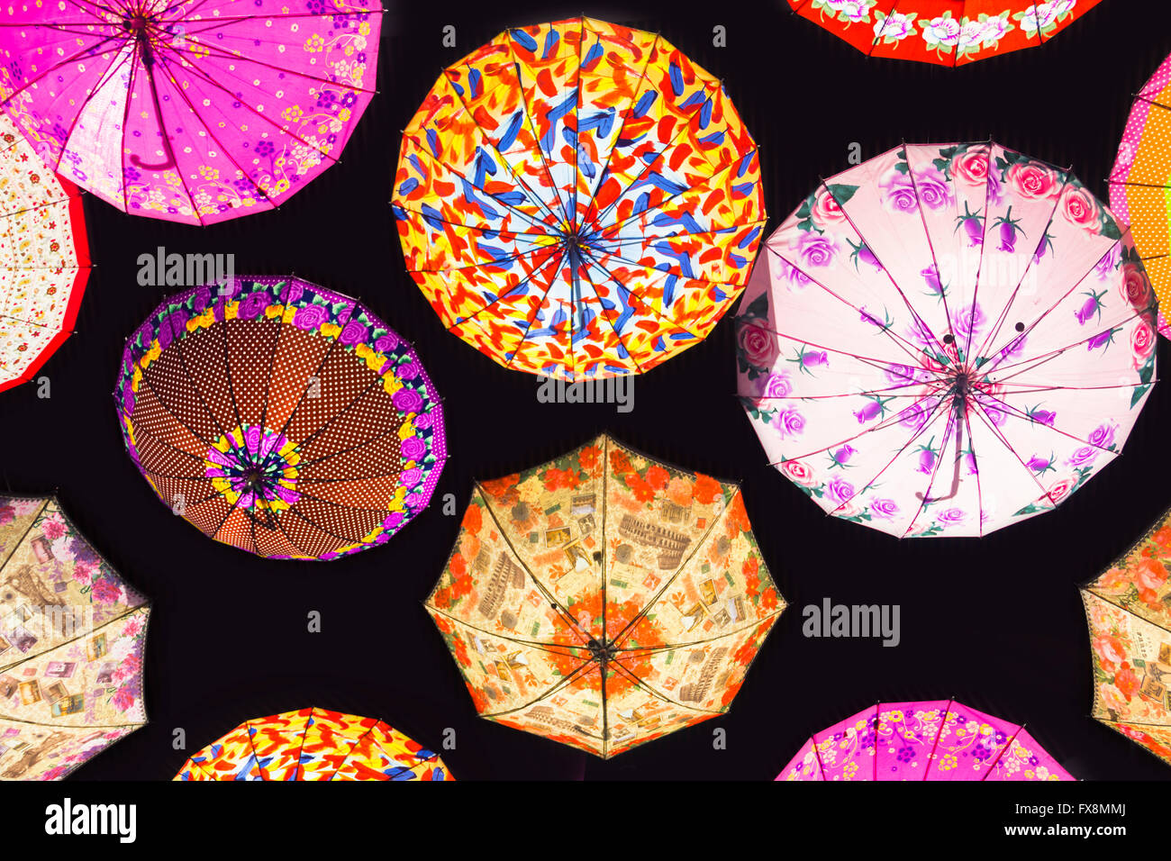 Umbrellas hanging in the sky above the street hi-res stock photography ...