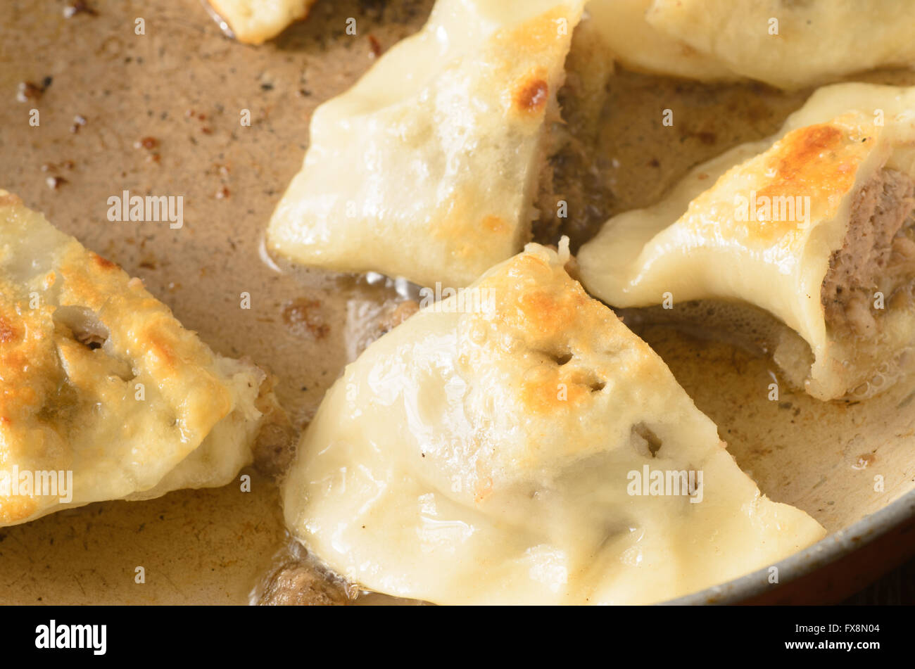 fried meat dumplings on pan Stock Photo - Alamy