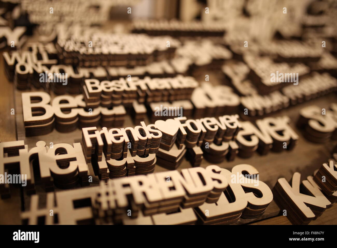 Writing carved out of wood in selective focus Stock Photo - Alamy